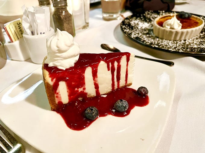 A cheesecake that doesn't just end the meal – it provides the grand finale. That berry sauce is writing love poems to your taste buds.