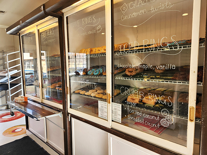 The glass case serves as a window into a better world—one where calories don't count and frosting is considered a food group.