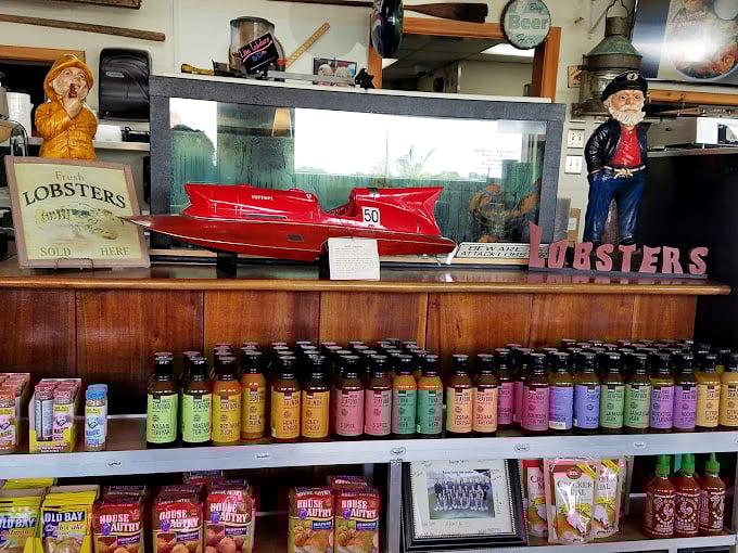 Hot sauces lined up like soldiers ready for duty, because sometimes even perfect seafood needs a little kick of personality.