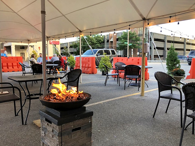 Outdoor dining elevated by a fire feature that says, "Yes, this is New Hampshire, and yes, we're eating outside anyway." Victory never tasted so good.