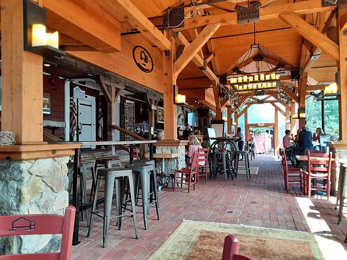 The covered patio beckons with its timber-framed charm—half rustic barn, half sophisticated dining space, all completely inviting.