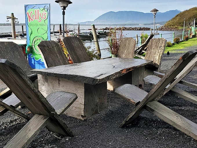 Weathered wooden tables with million-dollar views—the kind of authentic coastal dining experience no interior designer could ever replicate.