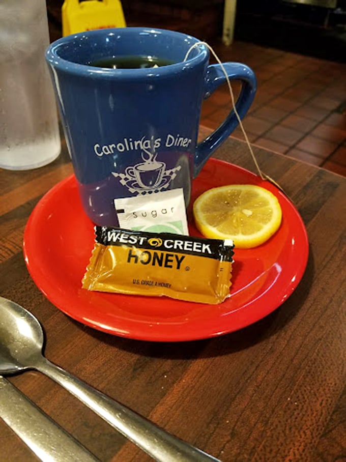 Hot tea served with lemon and honey packets—proof that even in a temple of coffee, other beverages get their moment of respect.