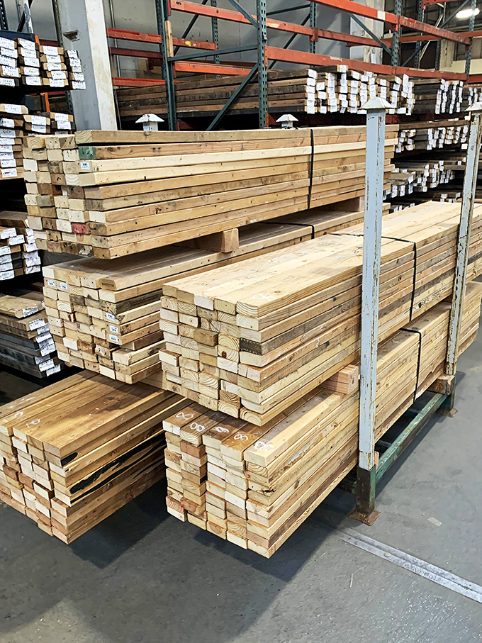 Stacks of reclaimed lumber waiting for their third act—from tree to building to whatever brilliant project you've been planning in your head.