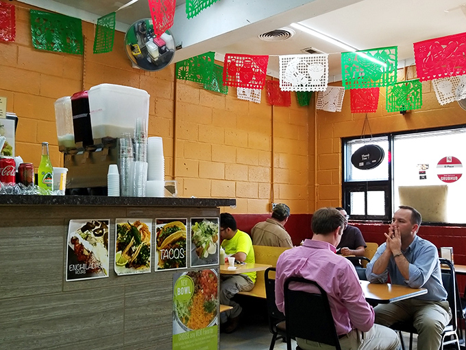 The colorful papel picado flags overhead aren't just decoration—they're celebration banners for the flavor party happening at every table.