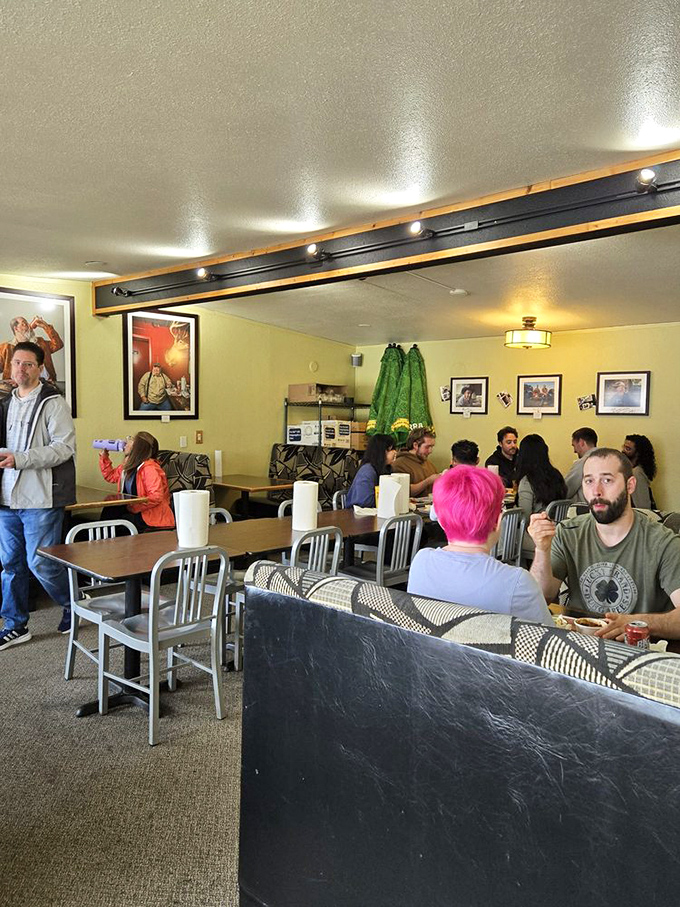The dining room hums with the universal language of barbecue appreciation. Notice the focused expressions—that's what meat meditation looks like.
