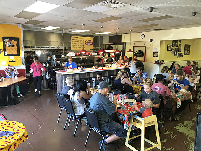 A packed house of happy diners—the universal sign of a place worth visiting. Every table tells a story of food-induced joy.