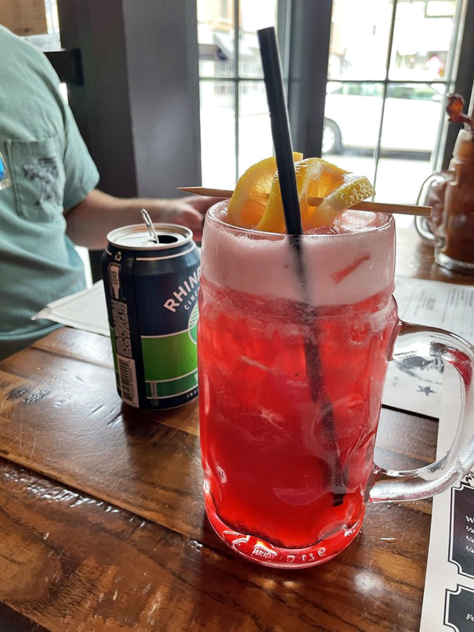 That's not just a drink—it's summer in a mason jar. The vibrant red lemonade promises refreshment with a hint of berry rebellion.
