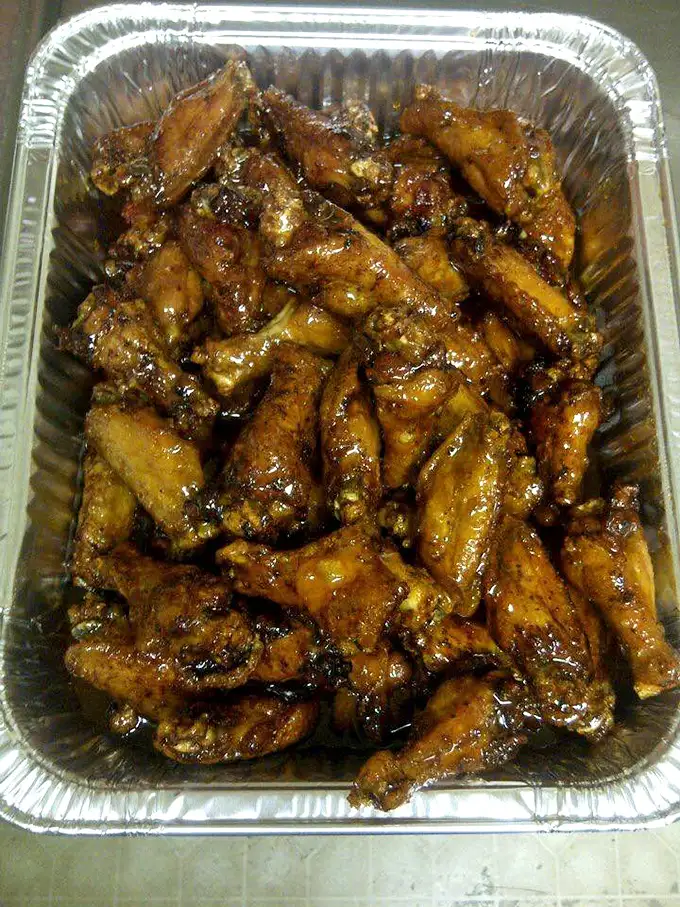 Wings that make you wonder why you ever bothered with those chain restaurants. That sticky, glistening sauce speaks volumes about flavor priorities.