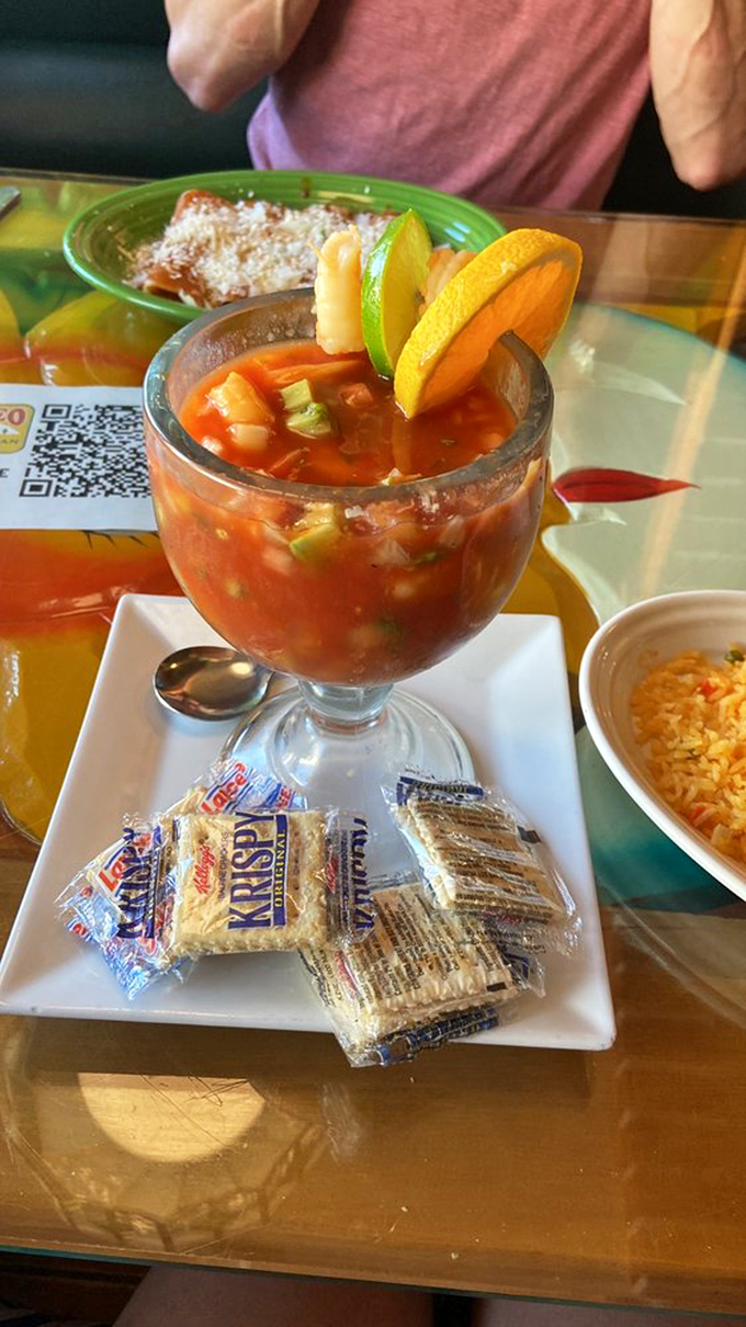 This seafood cocktail isn't just appetizing—it's a vacation in a glass, where shrimp swim in spicy tomato broth alongside lime and avocado lifeguards.