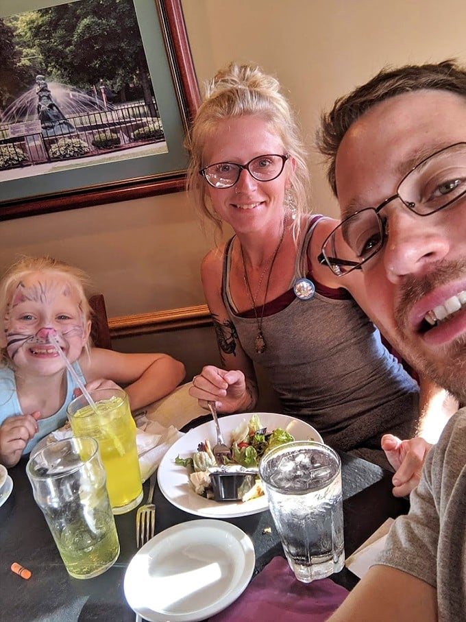 Families making memories over meals – the true magic of restaurants. That child's face says everything about the joy of dining together.