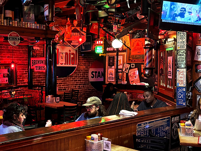The dining area feels like your coolest friend's basement—if that friend collected vintage signs and served life-changing burgers between stories.
