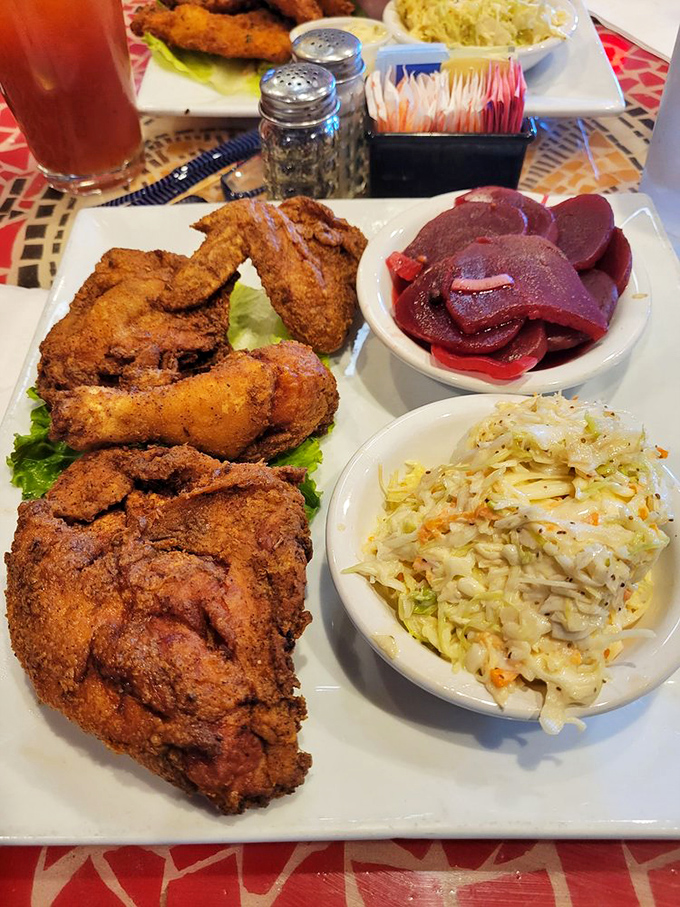 Fried chicken with pickled beets and coleslaw—a plate that proves comfort food doesn't need to be one-note. The South meets the Mid-Atlantic in perfect harmony.