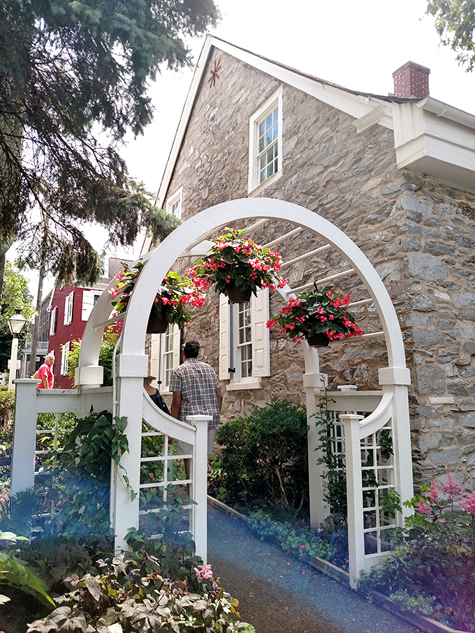 This garden archway doesn't just mark an entrance—it's practically begging to be the backdrop for engagement photos and "we just bought our first house" announcements.
