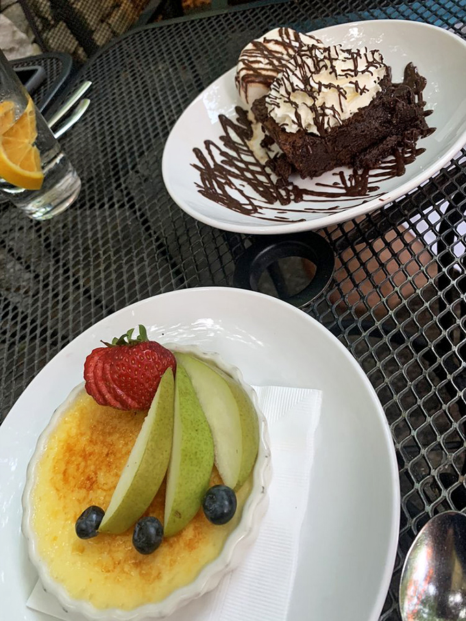 Desserts that make you consider skipping dinner altogether – crème brûlée adorned with fresh fruit and a chocolate creation that demands to be photographed first.