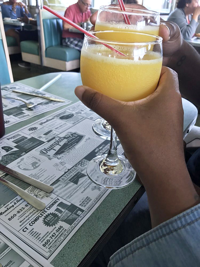 Orange juice in a wine glass—diner elegance defined. Somehow tastes better when sipped over yesterday's news and tomorrow's plans.