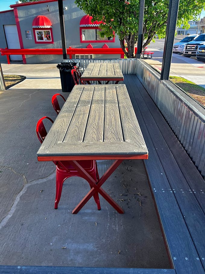 Oklahoma weather can be unpredictable, but these outdoor tables promise al fresco dining when the elements cooperate. Red chairs add the perfect touch.