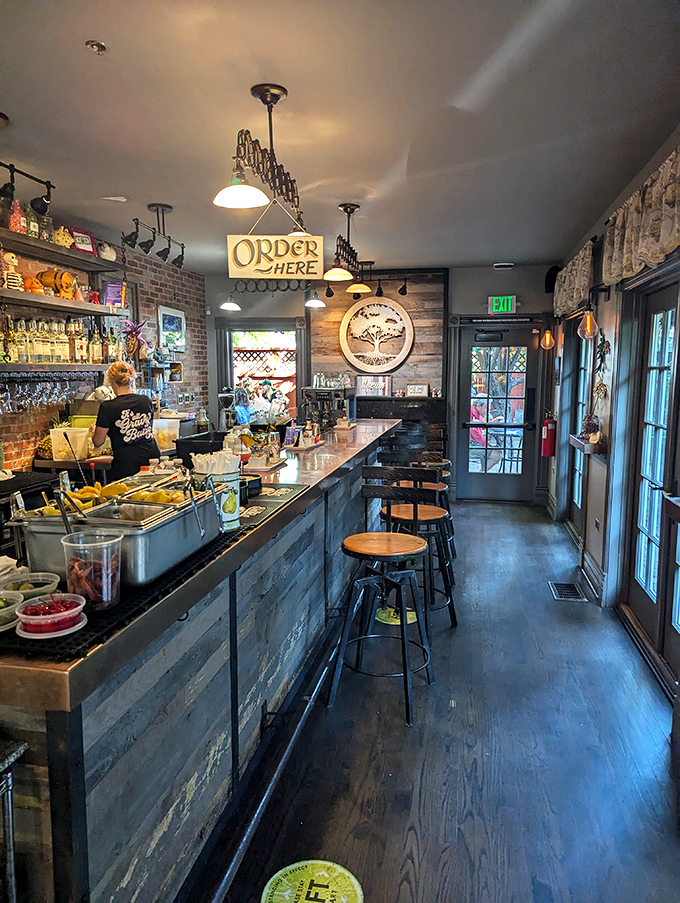 The bar area's "Order Here" sign might as well say "Happiness Begins Here"—a portal to Southern libations and hospitality.