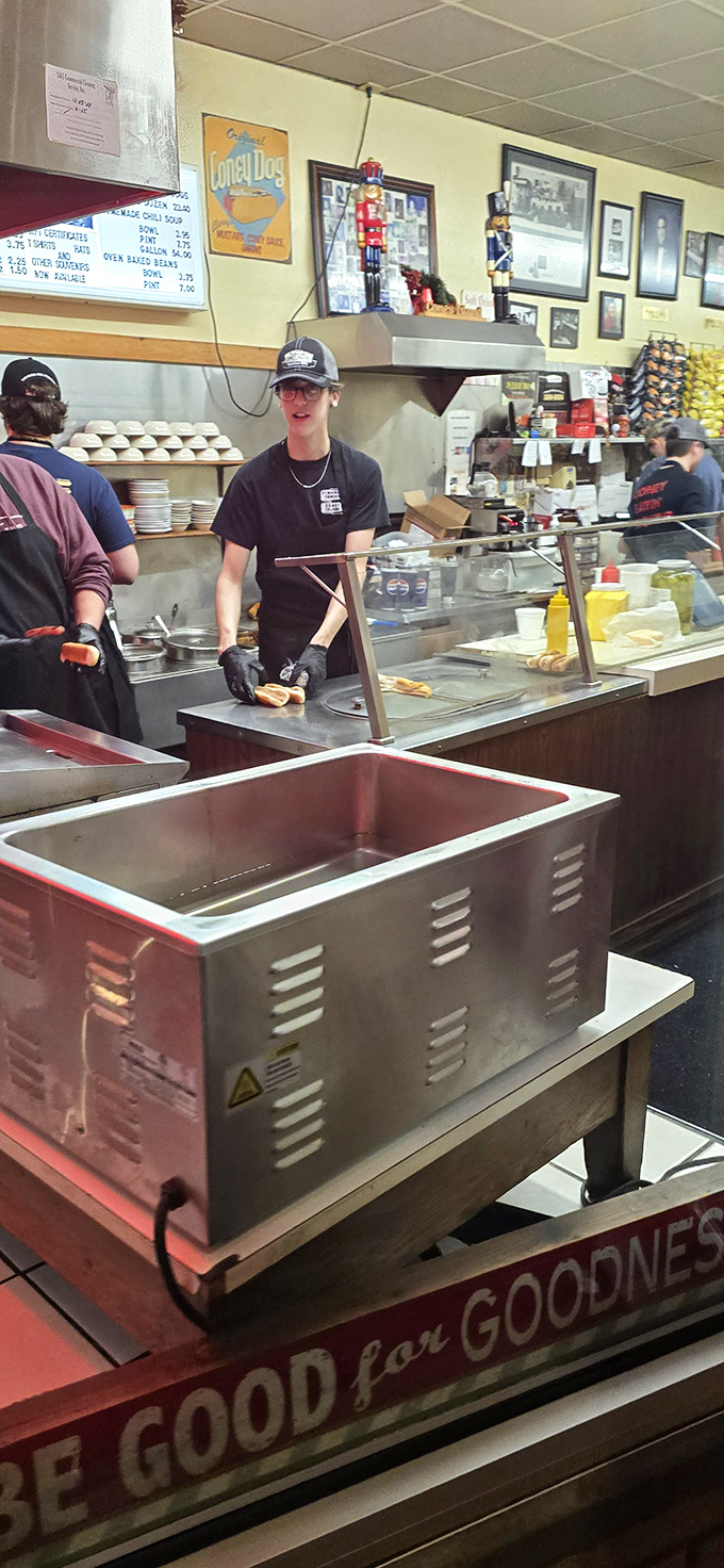 Behind the counter, the choreography of Coney creation continues as it has for decades—efficient, unpretentious, and absolutely essential.