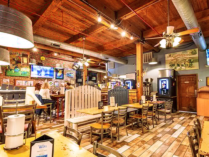 The bar area combines rustic charm with practical function – exactly where you want to perch while waiting for your barbecue bounty.