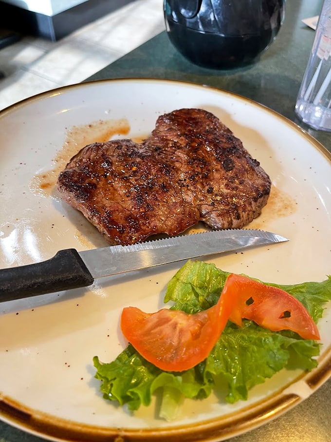 A steak cooked with the respect it deserves—simple seasoning, perfect sear, and just enough garnish to brighten the plate without distracting from the main event.