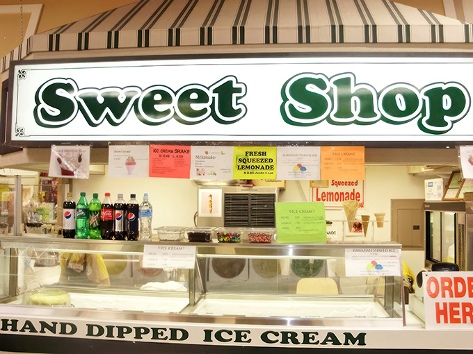 The Sweet Shop sign promises a momentary escape from adulting. Hand-dipped ice cream and fresh lemonade—simple pleasures that never go out of style.
