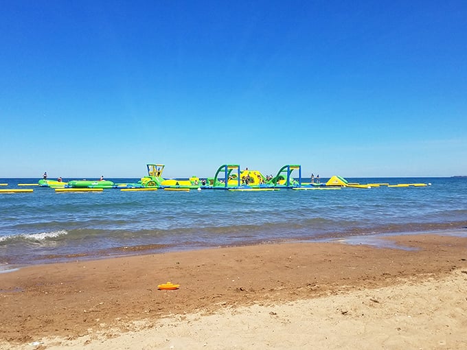 A floating obstacle course that looks like a cartoon come to life. From shore, WhoaZone appears as a colorful mirage—part water park, part ninja warrior training.