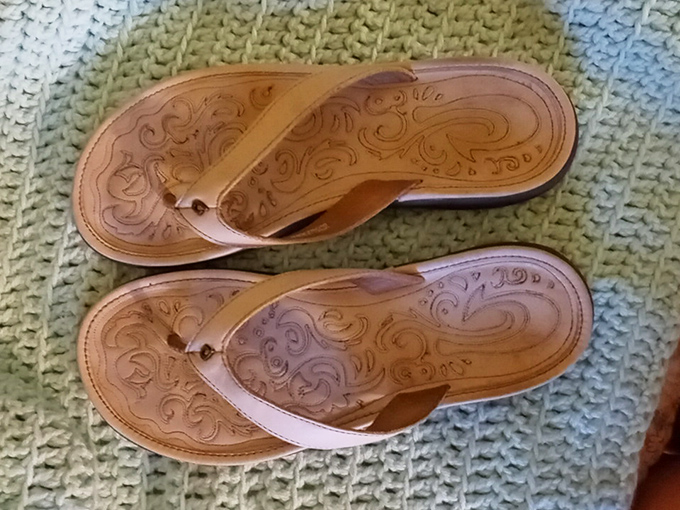 These leather flip-flops have barely touched pavement—someone's loss is your feet's new summer fling.