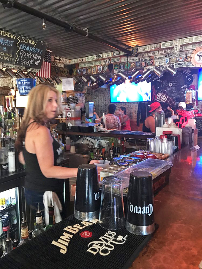 Behind the bar, where breakfast shots and Bloody Marys come to life. The corrugated metal ceiling reflects decades of good times and better meals.