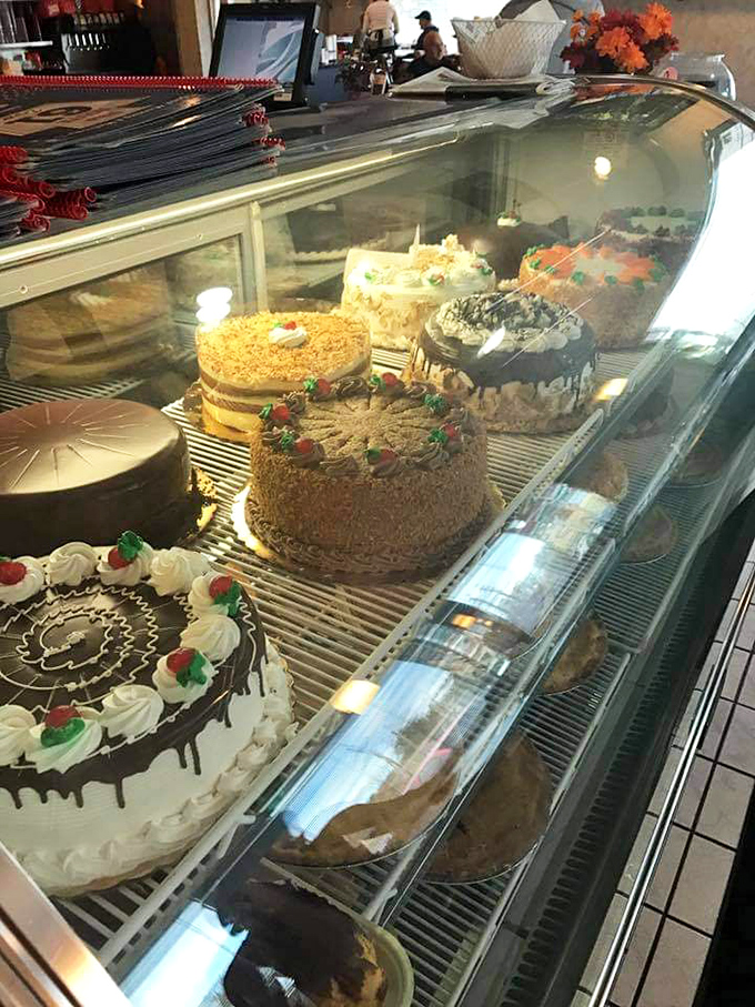That cake display isn't just dessert—it's edible architecture, a museum of sweetness where every slice is a masterpiece waiting to happen.