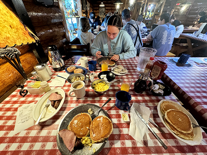 The dining room hums with the symphony of happy eaters. Notice how nobody's looking at their phones? That's the power of proper pancakes.