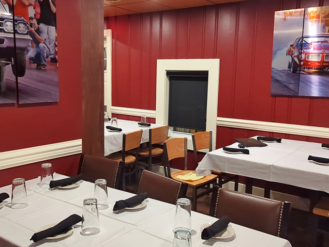 The dining area feels like it's saying, "Yes, we're serious about food, but we don't take ourselves too seriously." Those automotive photos add just the right touch of local character.