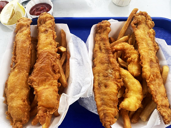 Two trays of perfection that prove sometimes the simplest pleasures—perfectly fried fish and hot fries—are life's greatest luxuries.