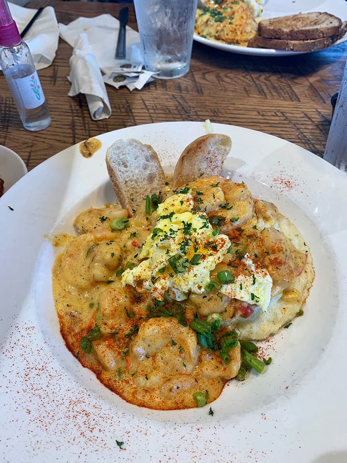 A masterclass in shrimp and grits presentation. Those green onions aren't just garnish—they're the exclamation point on a perfect culinary sentence.