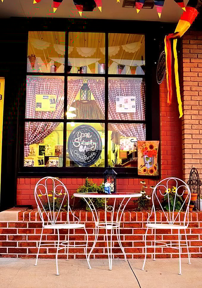 The storefront's charming café table invites you to linger with your treasures rather than rushing back to reality.
