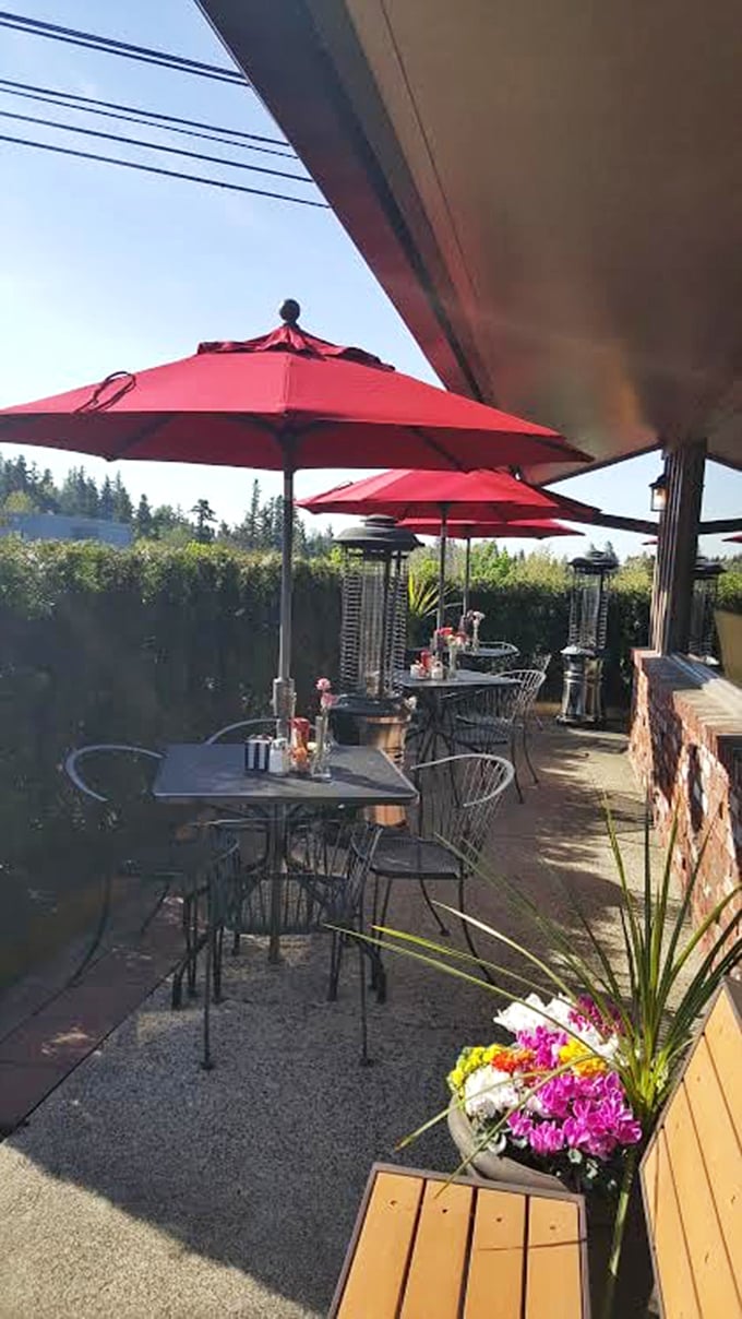 Red umbrellas dot the patio like cherry tops on sundaes. Oregon's greenery provides the perfect backdrop for outdoor dining done right.