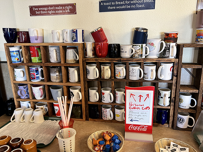 The personal coffee cup collection isn't just charming—it's a caffeinated community bulletin board where regulars stake their claim one mug at a time.