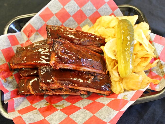 Ribs that showcase that perfect pink smoke ring—the barbecue equivalent of a designer label—telling you these weren't rushed but lovingly coaxed to perfection.