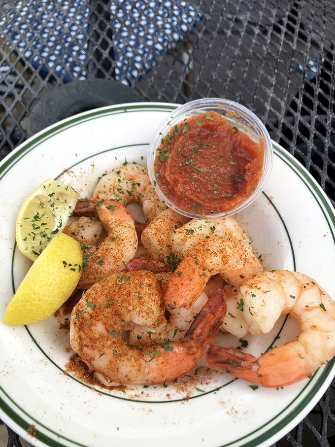 These seasoned shrimp aren't just seafood—they're little coastal ambassadors visiting the mountains, dressed in their spicy best with lemon on the side.