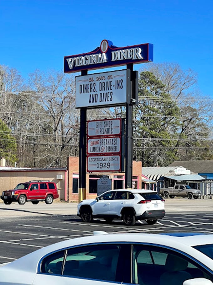The roadside sign stands tall, a landmark for hungry travelers. When you see this, your stomach knows relief is just moments away.