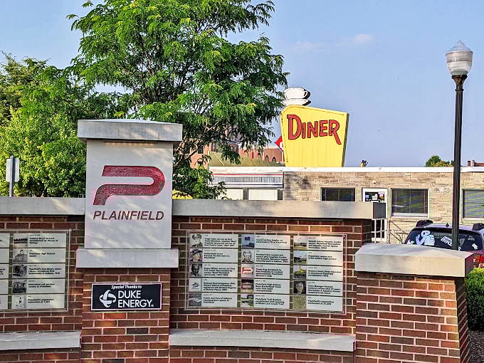 Plainfield pride on display near the diner's iconic sign—a reminder that the best landmarks aren't just destinations, they're community gathering spots.