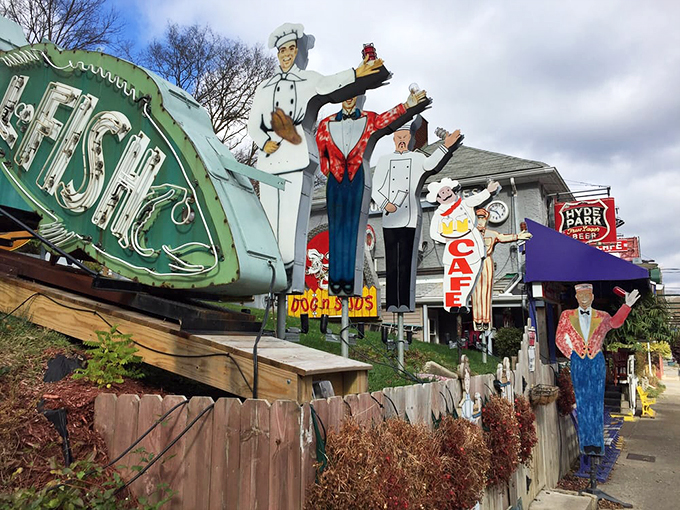 Not just a sign—a promise. The vintage "FISH" marquee and collection of service figures stand as quirky guardians of culinary treasures within.