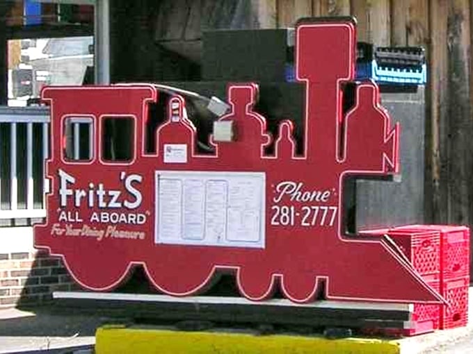 "Fritz's: All Aboard"—the sign promises not just a meal, but an experience that's been delighting train enthusiasts and burger lovers for generations.