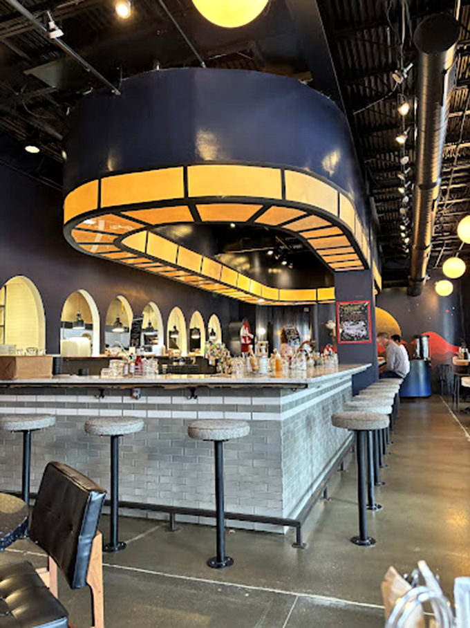 These aren't just bar stools—they're front-row seats to culinary theater, positioned perfectly for watching breakfast dreams become reality