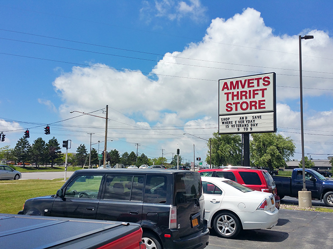 Under blue skies and fluffy clouds, the AMVETS sign announces its mission – serving veterans while serving up deals to savvy shoppers.