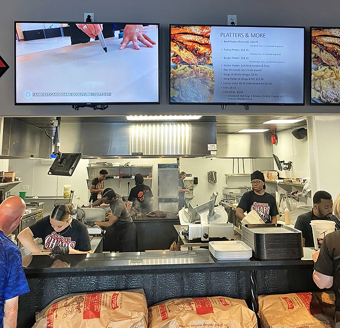 Behind the scenes where the magic happens: skilled hands transform simple ingredients into legendary sandwiches with practiced precision.
