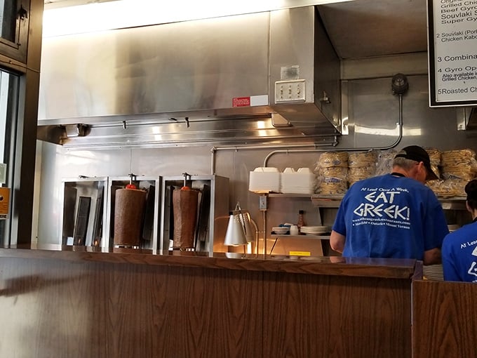 Behind the scenes where the magic happens: gyro spits slowly rotating like edible hypnosis, promising deliciousness with every revolution.