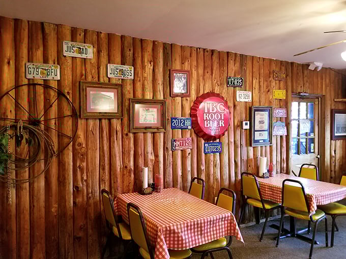 The wall decor tells stories of barbecue past—license plates and memorabilia that have witnessed countless sauce-stained smiles.