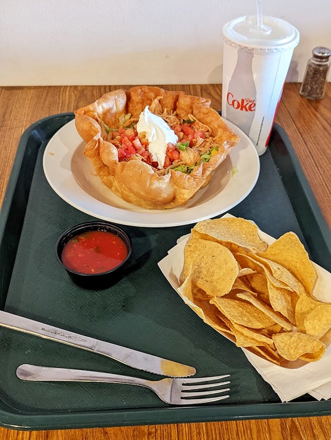 The taco salad bowl—where the vessel is as delicious as its contents. A crunchy, edible fortress protecting precious cargo of seasoned meat and fresh toppings.