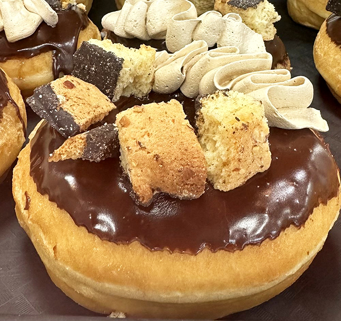 This chocolate-dipped masterpiece with cookie chunks is what happens when doughnuts decide to dress for a special occasion.